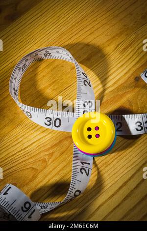 Button and Tailor Meter Stock Photo - Alamy