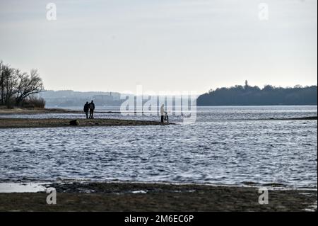 ZAPORIZHZHIA, UKRAINE - JANUARY 3, 2023 - People walk along the edge of ...