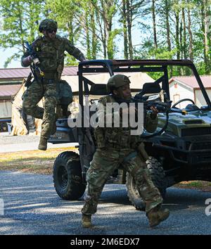 Airmen from the 633d Security Forces Squadron practice proper procedures in a simulated ...