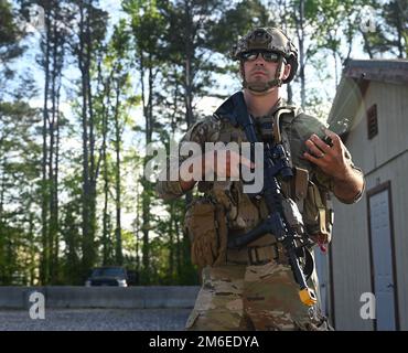 Airmen from the 633d Security Forces Squadron practice proper procedures in a simulated ...