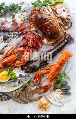 Fresh seafood on ice background Stock Photo - Alamy