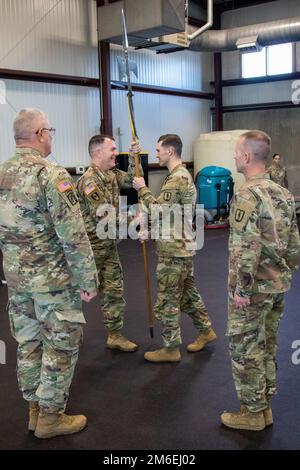 Command Sgt. Maj. Dean Reicks (center), poses with mementos of his time ...