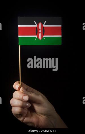 Hands Holding Flag of the Nation Kenya Stock Photo - Alamy