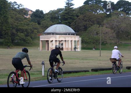 Cyclists pass Federation Pavilion, Centennial Park, Sydney, NSW ...