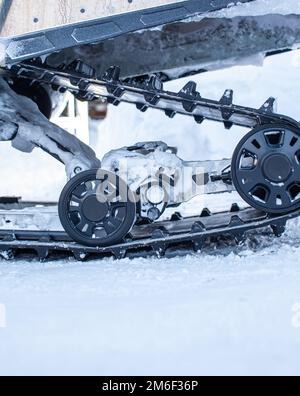 The back of the snowmobile in winter. Riding in the snow on a ...