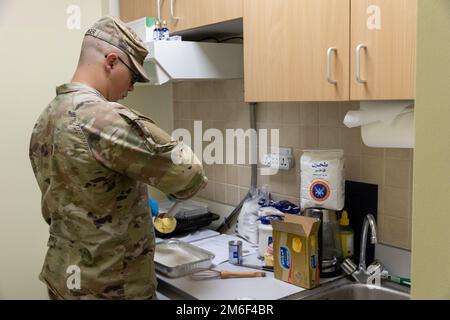During sunset at Camp Arifjan, Kuwait, Soldiers of the 191st Combat ...