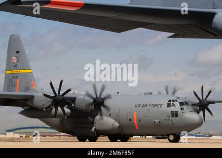 A C-130 from the 153d Airlift Wing equipped with USDA Forest Service ...