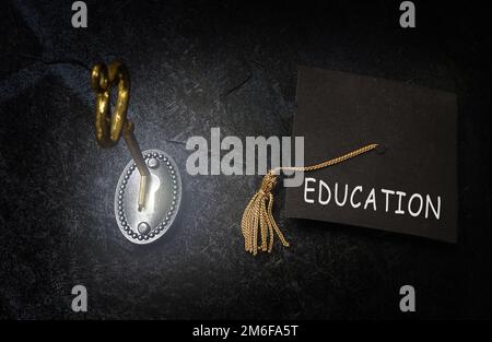 Graduation cap and key Stock Photo - Alamy