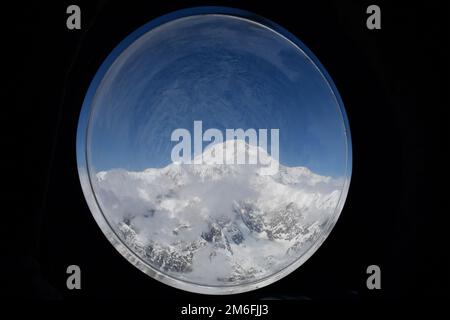 The bubble window of a CH-47F Chinook helicopter provides a circular ...