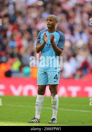 Vincent Kompany of Manchester City look on after the defeat to Arsenal ...
