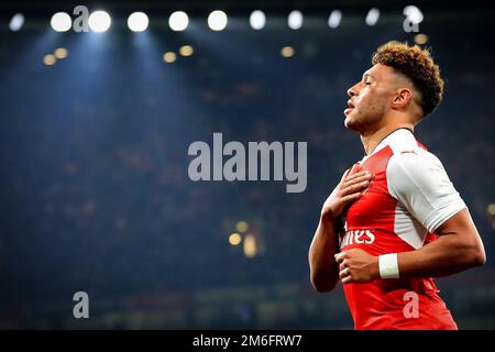 Alex Oxlade-Chamberlain of Arsenal celebrates with Alex Iwobi of ...