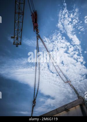 a Roof with solar photovoltaic panels photovoltaic and crane above it ...
