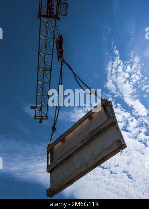 a Roof with solar photovoltaic panels photovoltaic and crane above it ...