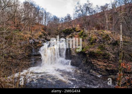 Winter view of Falls of Falloch, a picturesque waterfall in Loch Lomond ...