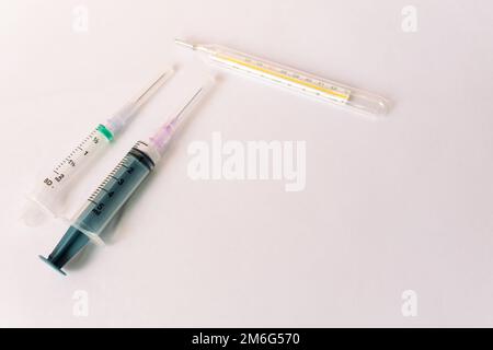 Thermometer, syringe, Concept of autumn common cold, covid or flu Stock ...
