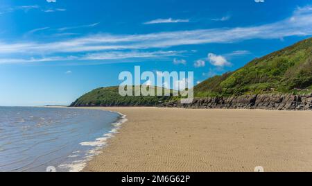 View of LLansteffan beach in southern Wales surrounded by sand, houses ...