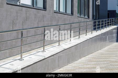 Outdoor stairs with ramp and metal railing Stock Photo - Alamy
