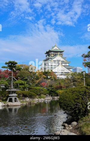 Scenic landscape of Osaka Castle Park, with Osaka Castle reflecting in ...