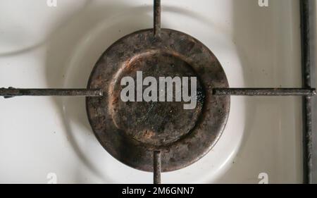 Dirty gas stove surface with grease stains and burn marks close-up ...