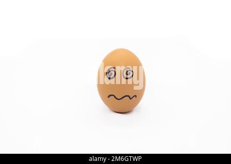 Egg with confused face drawing, white background Stock Photo - Alamy