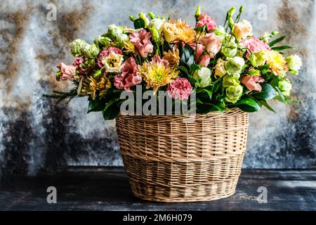 Floral wedding composition with seasonal flowers and greens as a place ...
