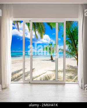 Large glass door overlooking the beach Stock Photo - Alamy