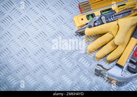 Leather safety gloves construction level on wooden board Stock Photo ...