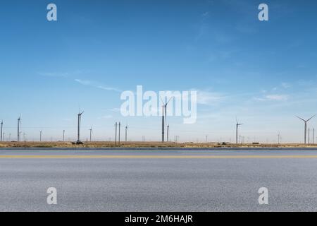 Asphalt road and wind turbines Stock Photo - Alamy