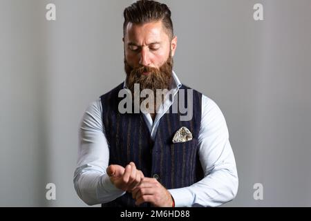 Portrait of young bearded hipster male with microphone headset on head ...