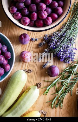 background of fruits, vegetables and herbs. plum, zucchini, lavender ...