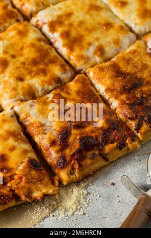 Homemade Grandma Cheese Pizza Pie with Tomato Sauce Stock Photo - Alamy