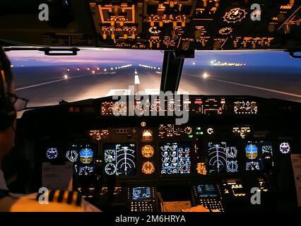 Cockpit of a passenger plane. View from the cockpit during Stock Photo ...