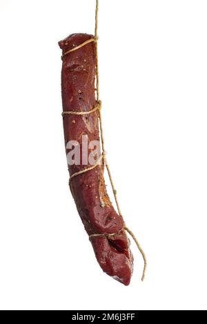 Hanging raw pork tenderloin on white Stock Photo - Alamy