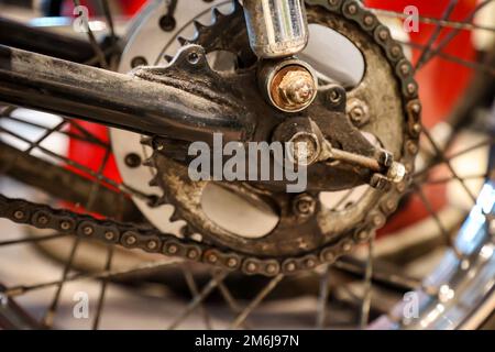 The rear wheel of a motorcycle with the gear for the drive Stock Photo ...