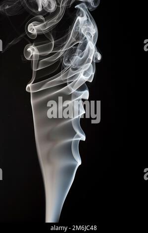 Abstract Smoke swirls on black background Stock Photo - Alamy