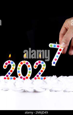 Happy new year 2027 - White wooden letters on red background Stock ...