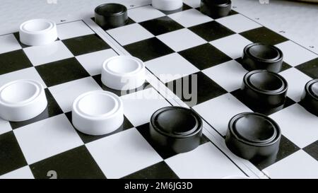 Checkers game, hobby. Close-up of a hand moving checkers, fast shooting ...
