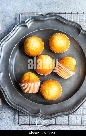 Tasty mini cupcakes on a vintage background, sweet dessert for ...
