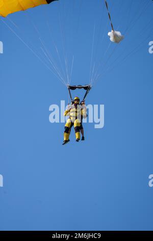 Staff Sgt. Daniel Osorio of the U.S. Army Parachute Team makes a tandem ...