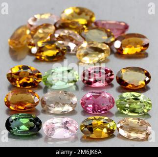 Natural beautiful stones multicolored tourmaline on a gray background ...