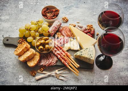Antipasto board with various cheese and snacks. Flat lay Stock Photo ...