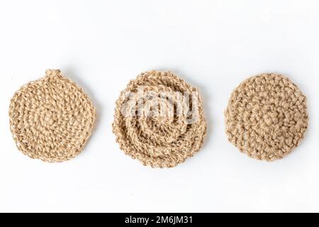 Natural washcloth made of craft thread for washing dishes. The concept ...