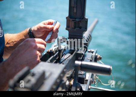 Coast Guard Cutter Daniel Tarr crew members conduct M2 Browning .s0 ...