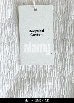 Recycled cotton fashion label tag, sale price card on luxury fabric ...