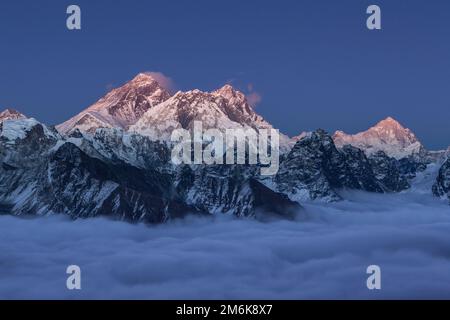 Breathtaking sunset over Mount Everest summit colored in an ...