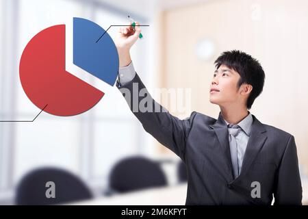 A young business man draw pie chart Stock Photo - Alamy
