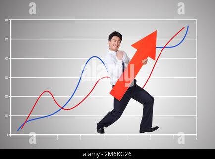 A young business man drawing curve chart Stock Photo - Alamy