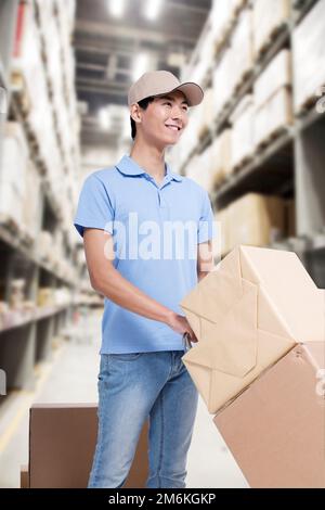 Trolley freight logistics warehouse staff Stock Photo - Alamy