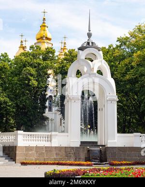 Mirror Stream fountain. White building with a distinctive gold roof in ...