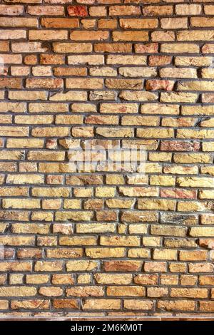 A brick wall, made of treated, antique-styled brick. High quality ...